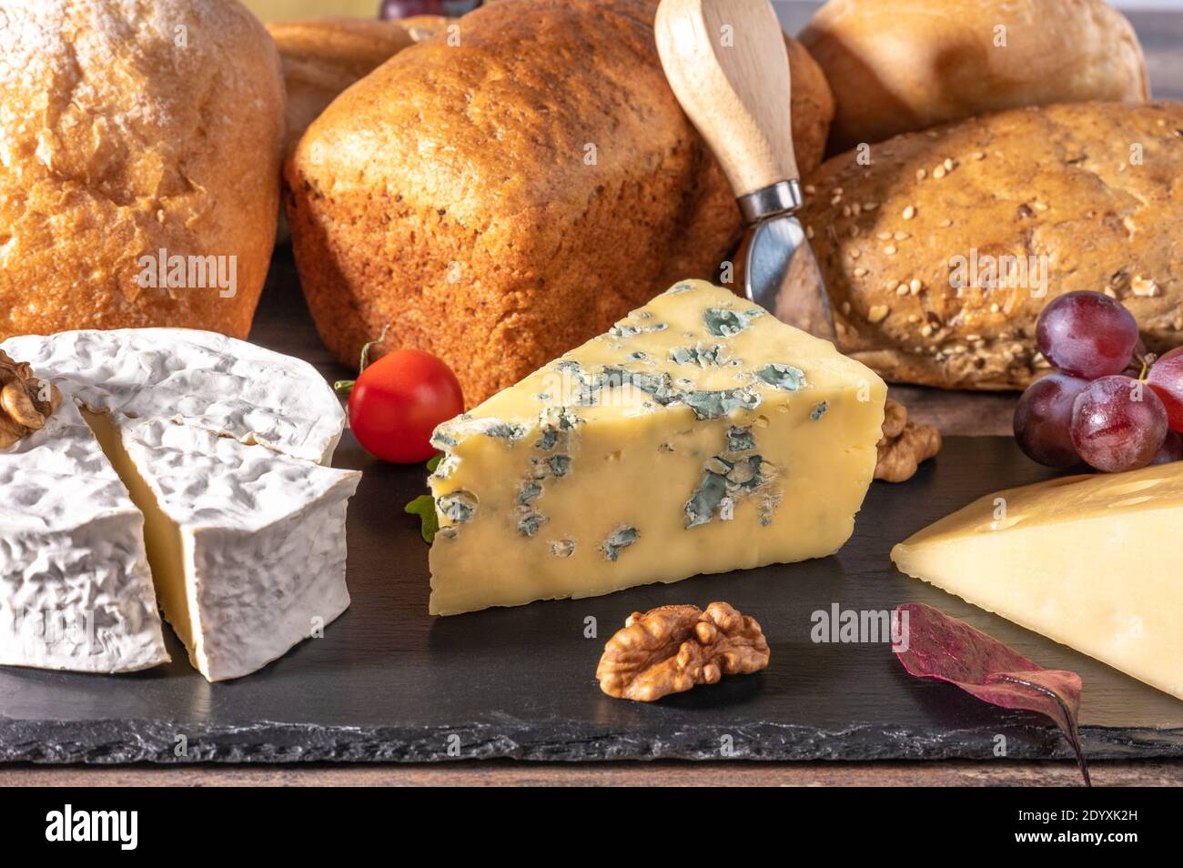 cheese and bread. many types of bread and cheese. cheese platter ...