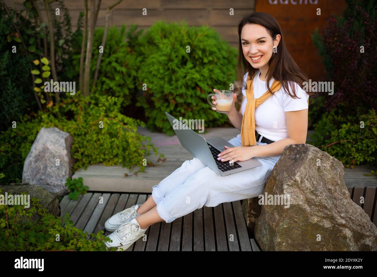 successful woman freelancer cute smiling sitting outdoors with computer ...