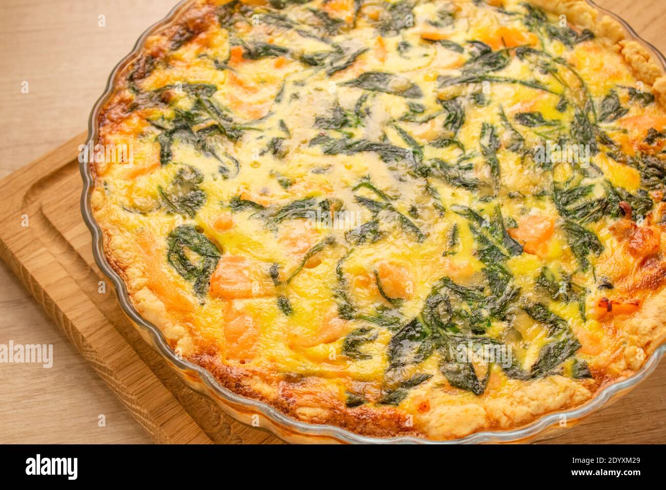 Seafood and salmon fish quiche pie with baby spinach leaves- homemade ...