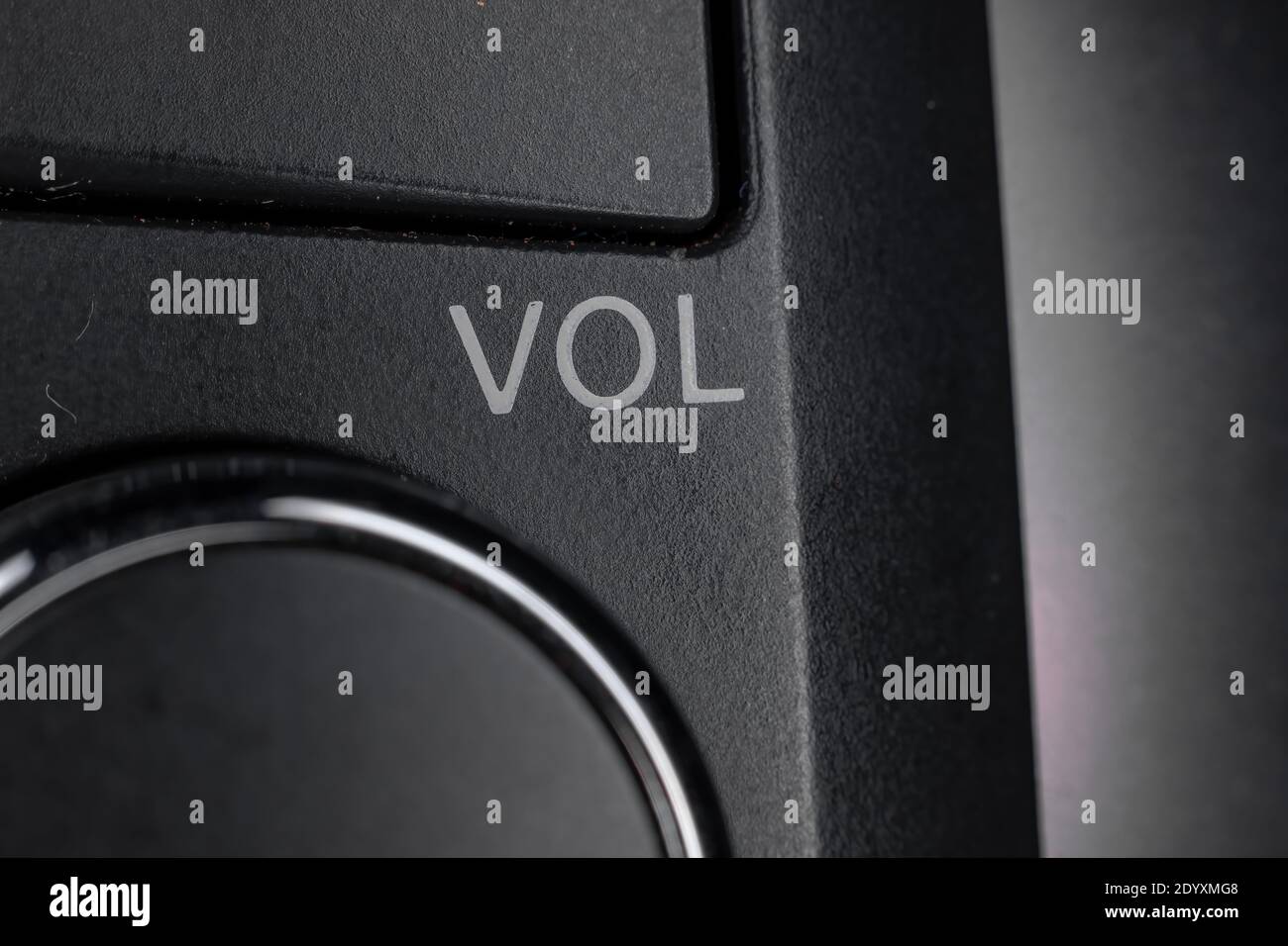 Macro photography taking volume text next to a car's volume button ...
