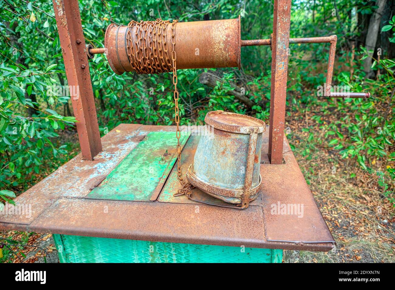 Old water well with rusty bucket . Underground water concept Stock ...