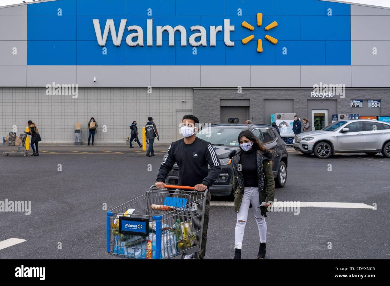 VALLEY STREAM, NY – DECEMBER 24: People exit the Walmart store on ...