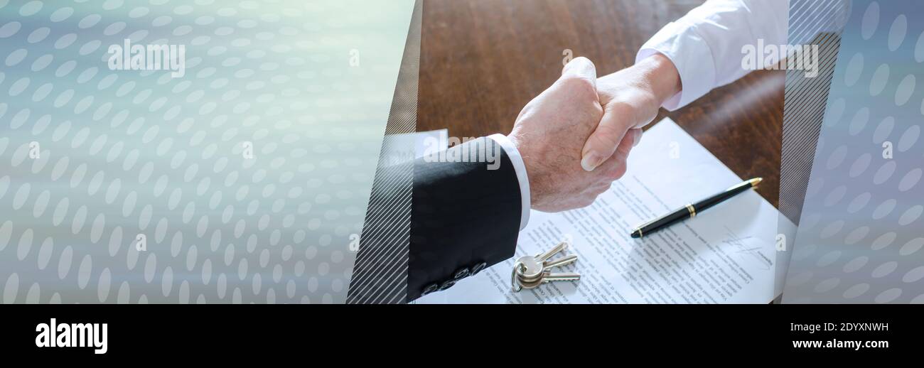 Estate agent shaking hands with his customer after contract signature ...