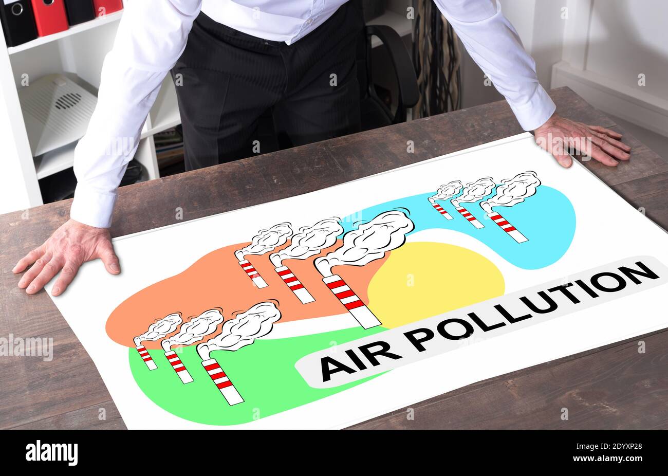 Man watching an air pollution concept placed on a desk Stock Photo - Alamy