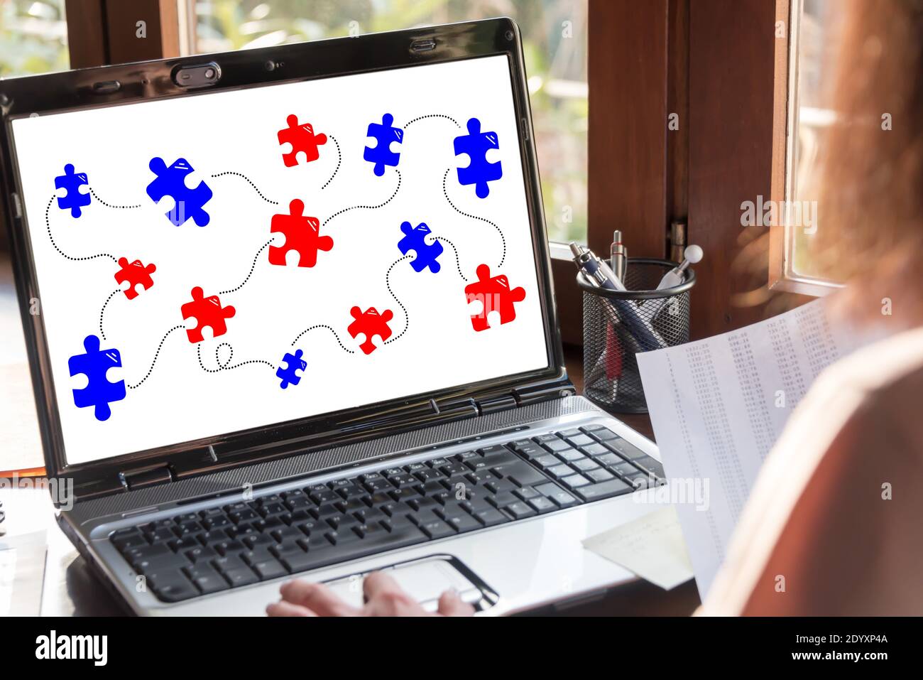 Laptop screen showing teamwork concept Stock Photo - Alamy