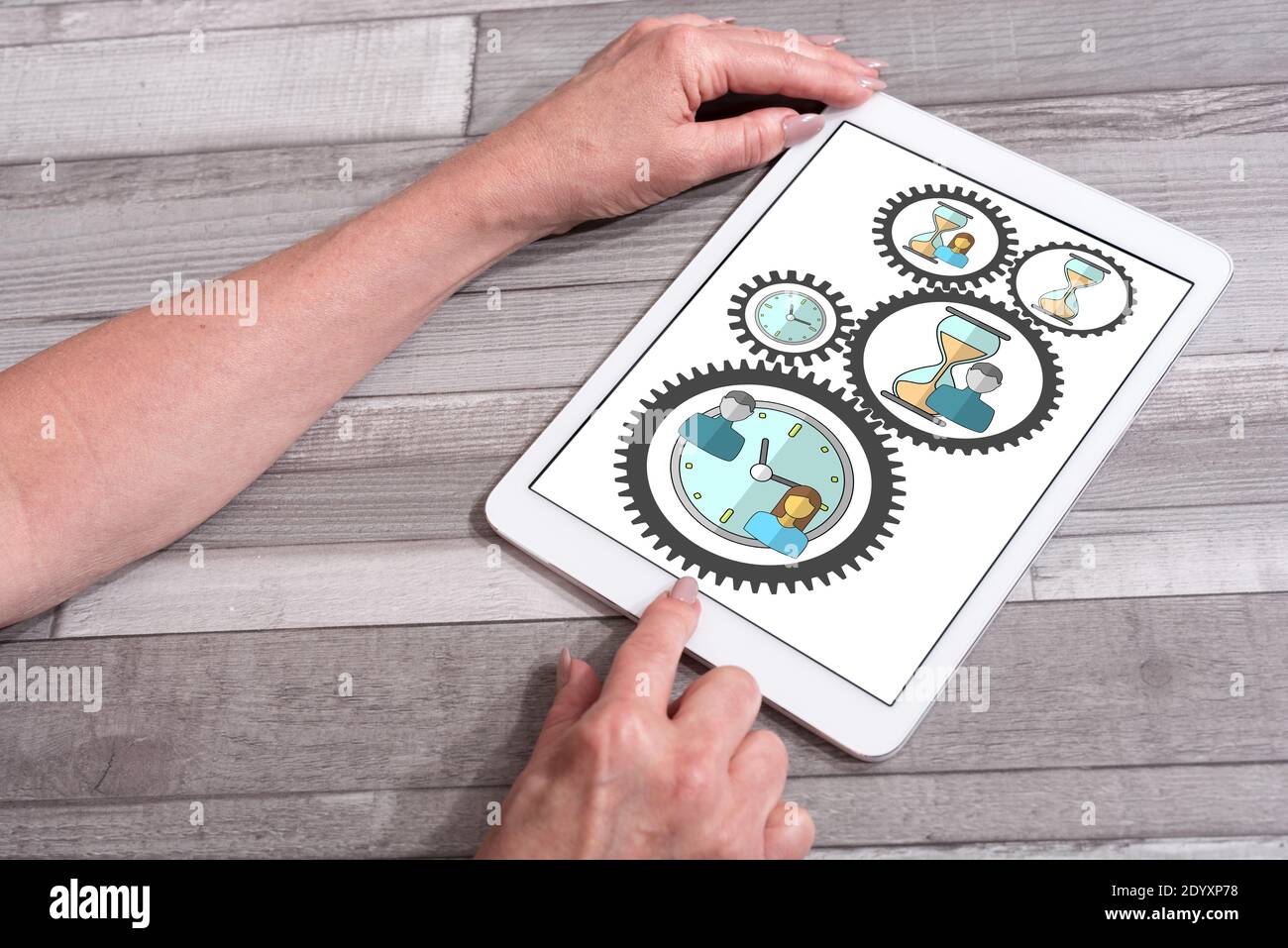 Time management concept shown on a tablet used by a woman Stock Photo ...
