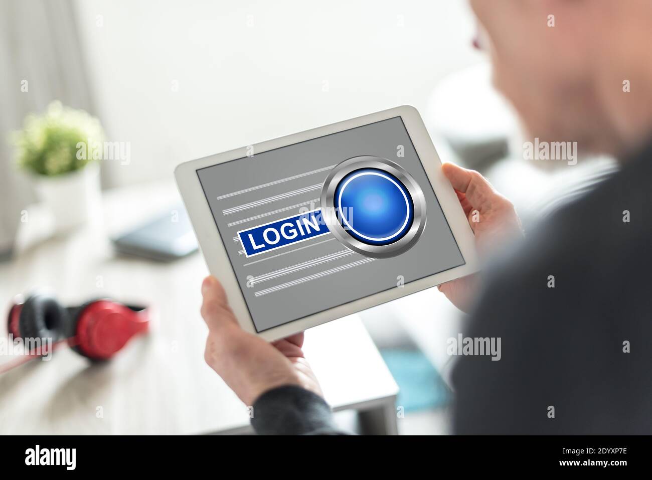 Tablet screen displaying a login concept Stock Photo - Alamy