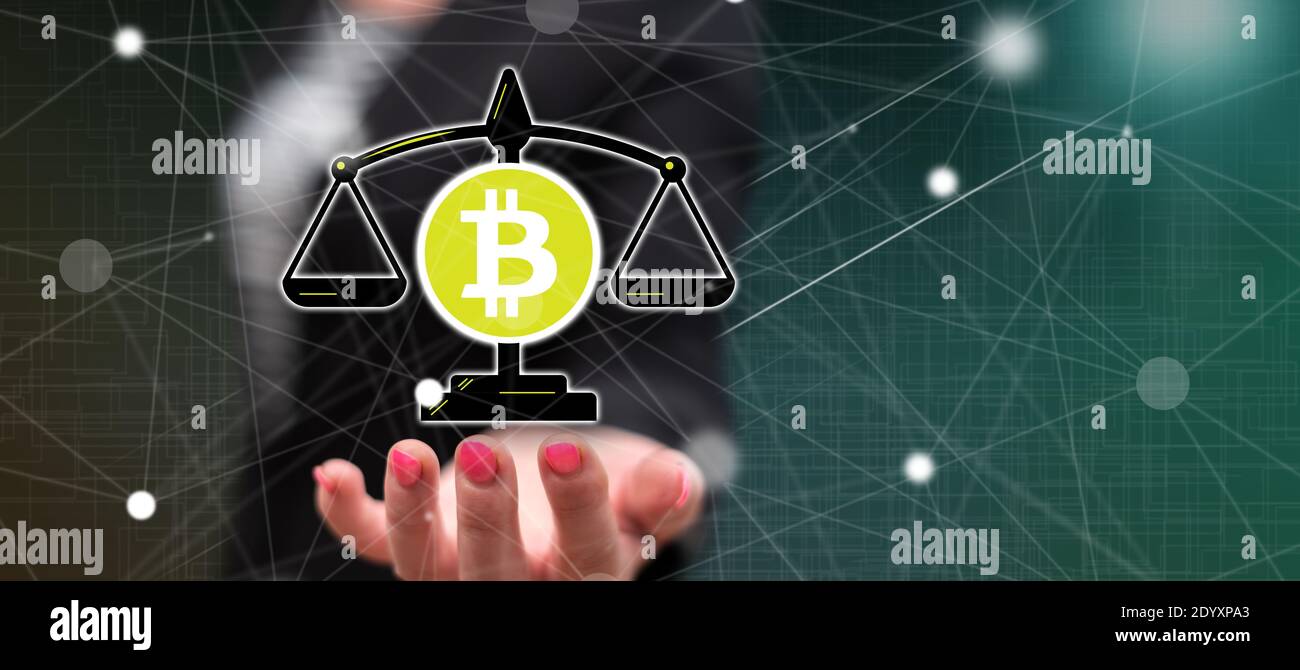 Bitcoin regulation concept above the hand of a woman in background ...