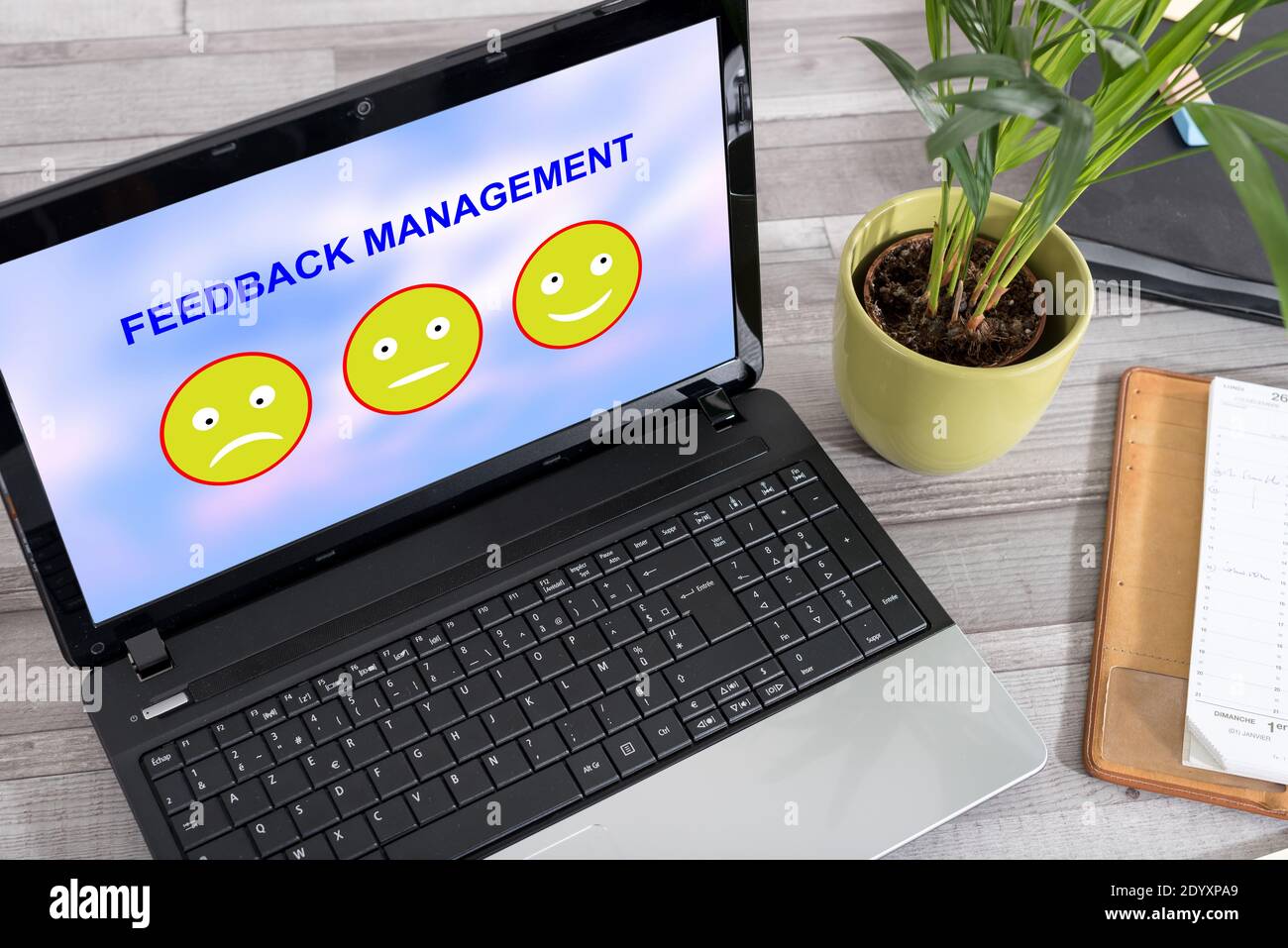 Laptop screen with feedback management concept Stock Photo - Alamy