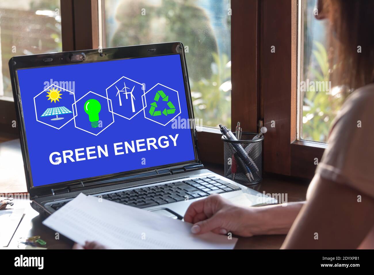 Laptop screen displaying a green energy concept Stock Photo - Alamy