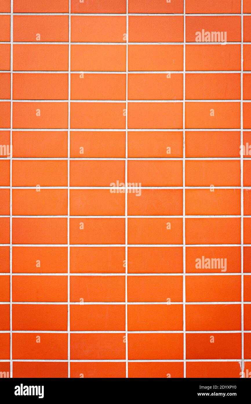 Modern weathered red tile wall texture background Stock Photo - Alamy