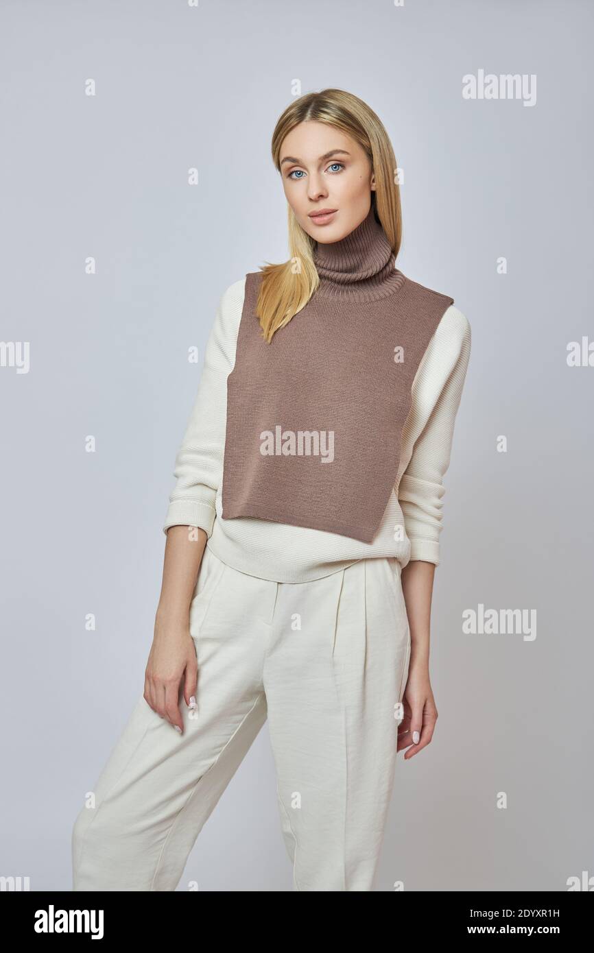 Blonde woman with a shirt front around her neck. Clothing for autumn ...