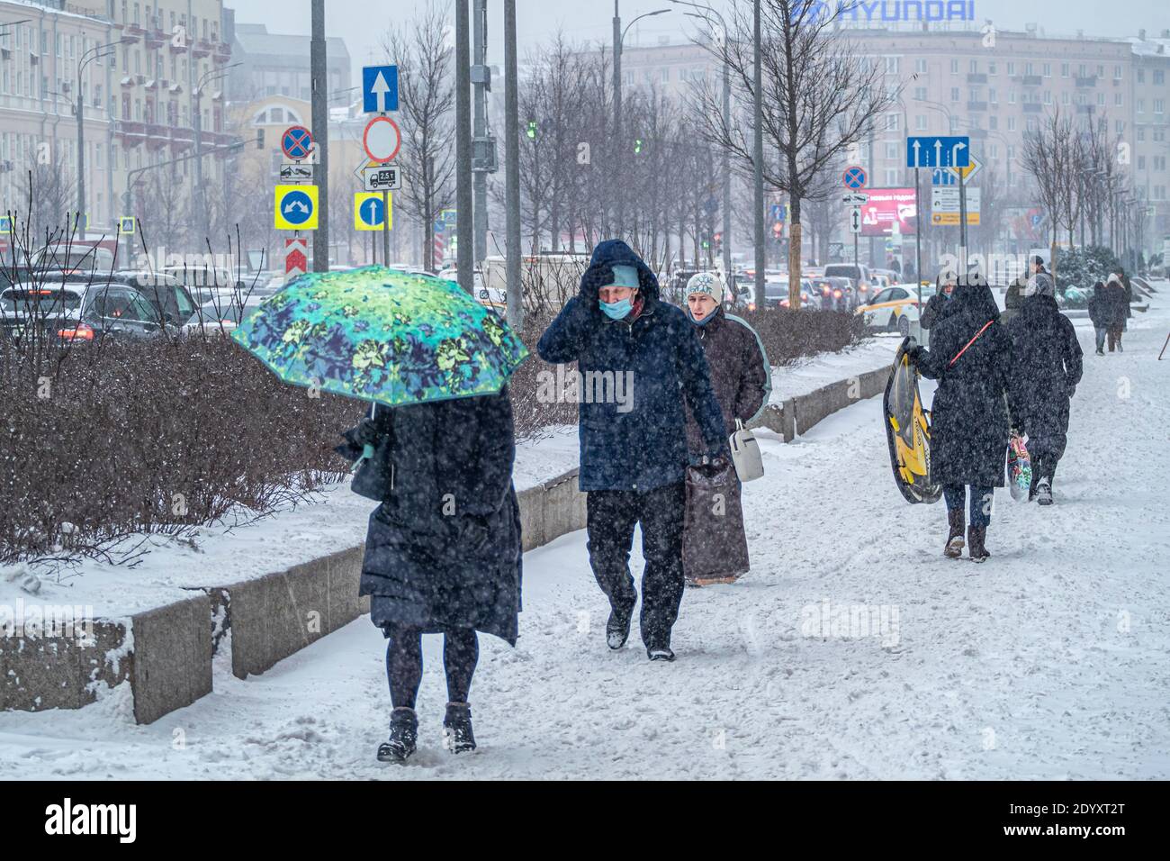 Snowfall in Moscow, Russia. People walk in a street Stock Photo - Alamy