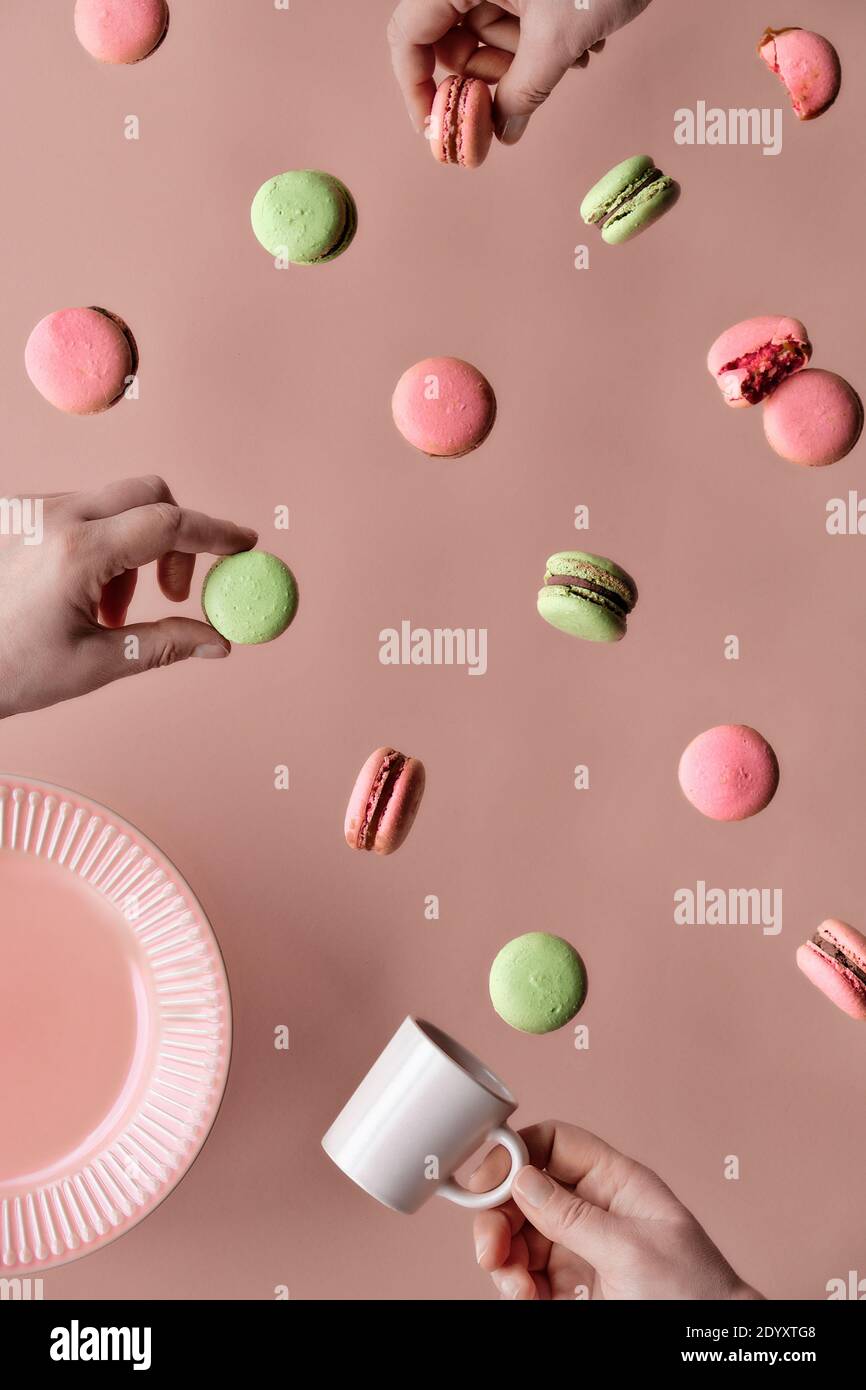 Levitation of macaroons, creative food concept. Flying macaroons, plate ...