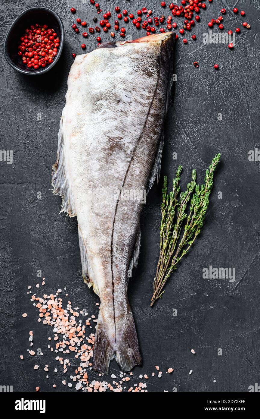 Fresh haddock fish carcass. Black background. Top view Stock Photo - Alamy