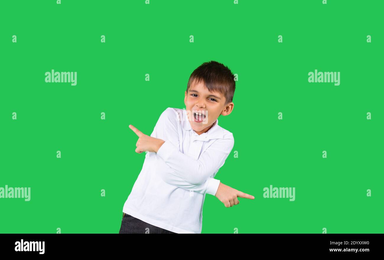 A cheerful boy joyfully shows hands in different directions. Children's ...