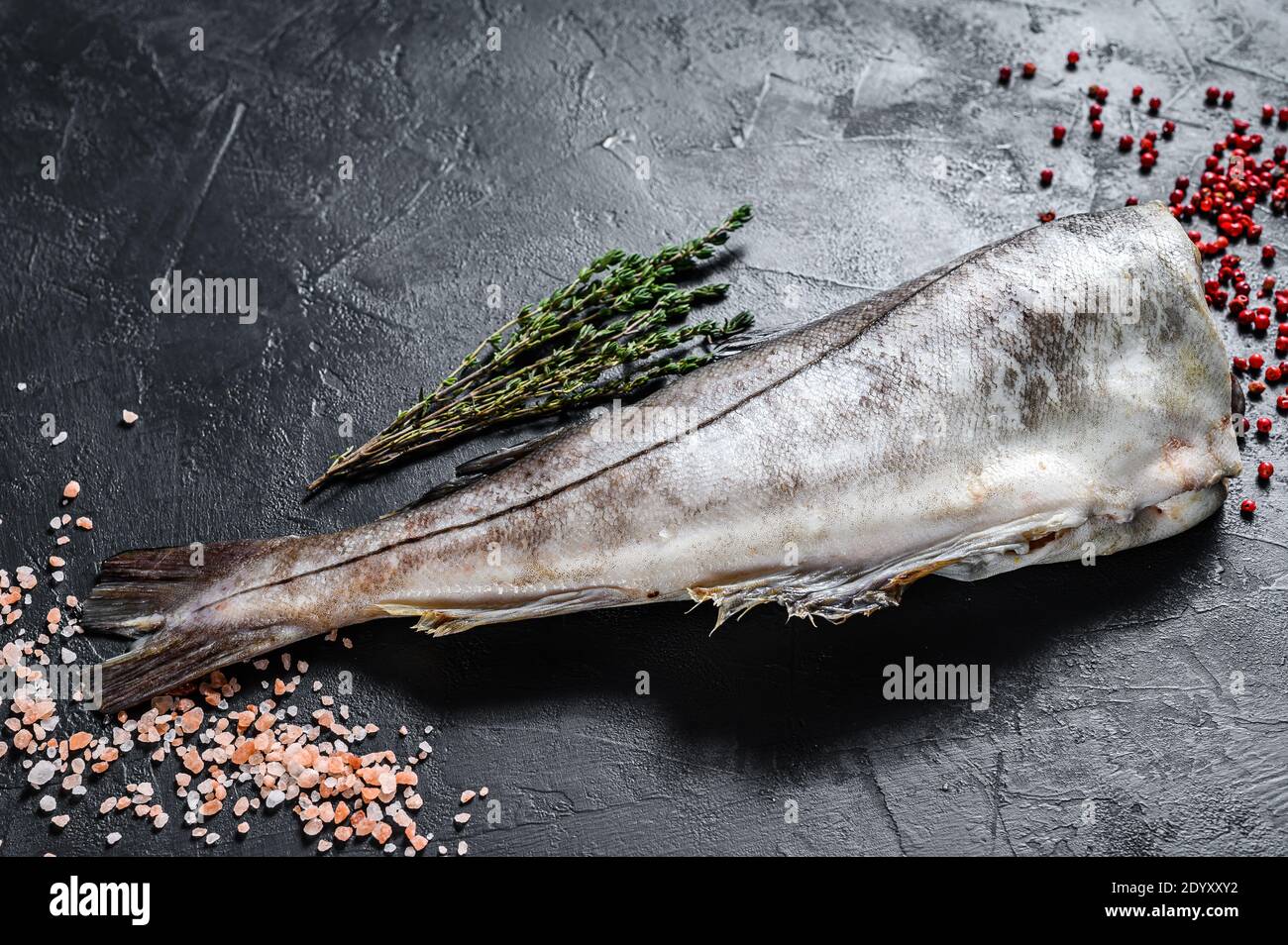 Fresh haddock fish carcass. Black background. Top view Stock Photo - Alamy