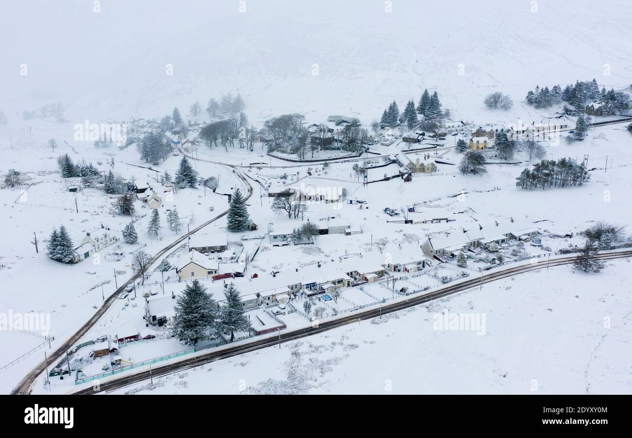 Aerial view of Wanlockhead village covered in winter snow, Dumfries and ...
