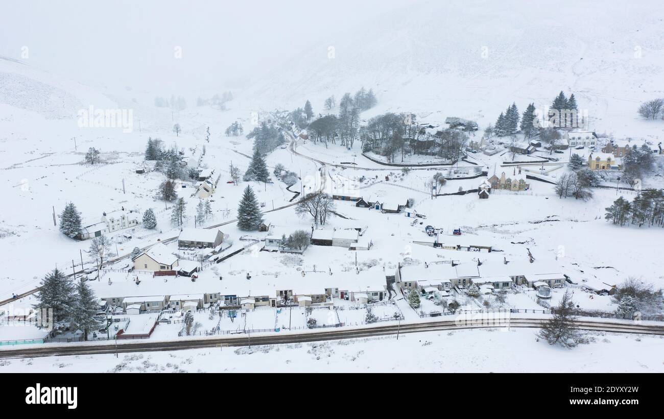 Aerial view of Wanlockhead village covered in winter snow, Dumfries and ...