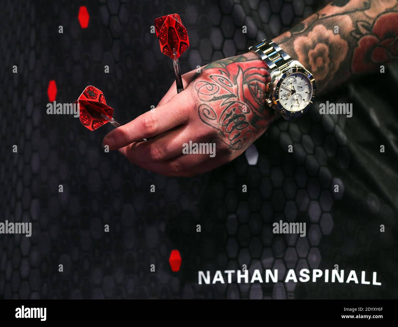 General view of Nathan Aspinall's tattooed hand and match t-shirt ...