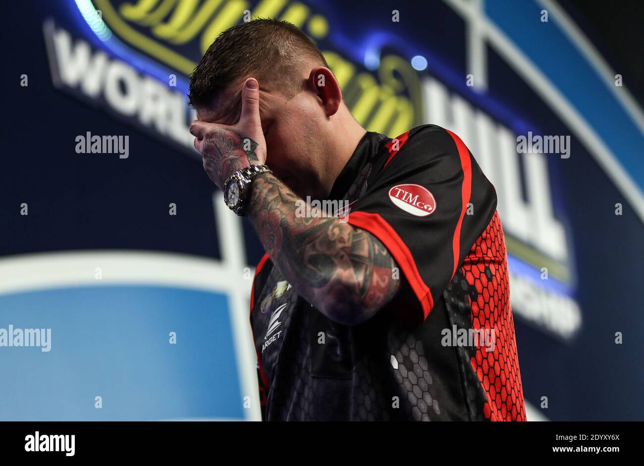 Nathan Aspinall walks off stage with his head in his hands after losing ...