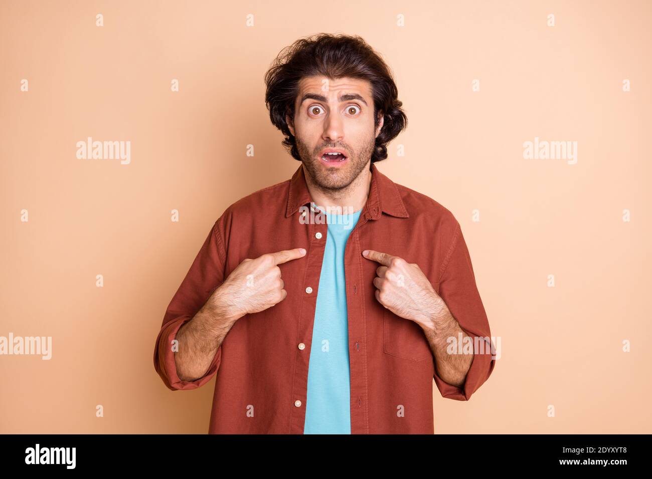 Portrait of attractive worried guy pointing at himself wow shock ...