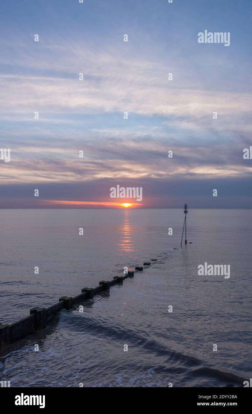 Half submerged groyne at sunset on Hunstanton Beach, Norfolk, England ...