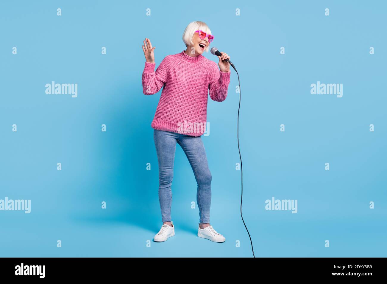 Photo portrait full body view of old lady singing holding mic in one ...