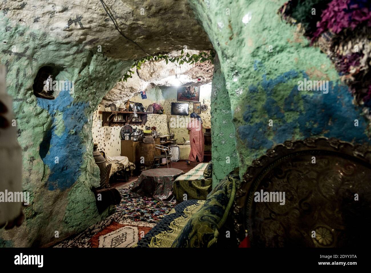 A berber woman is preparing a berber tea, in her traditional home ...