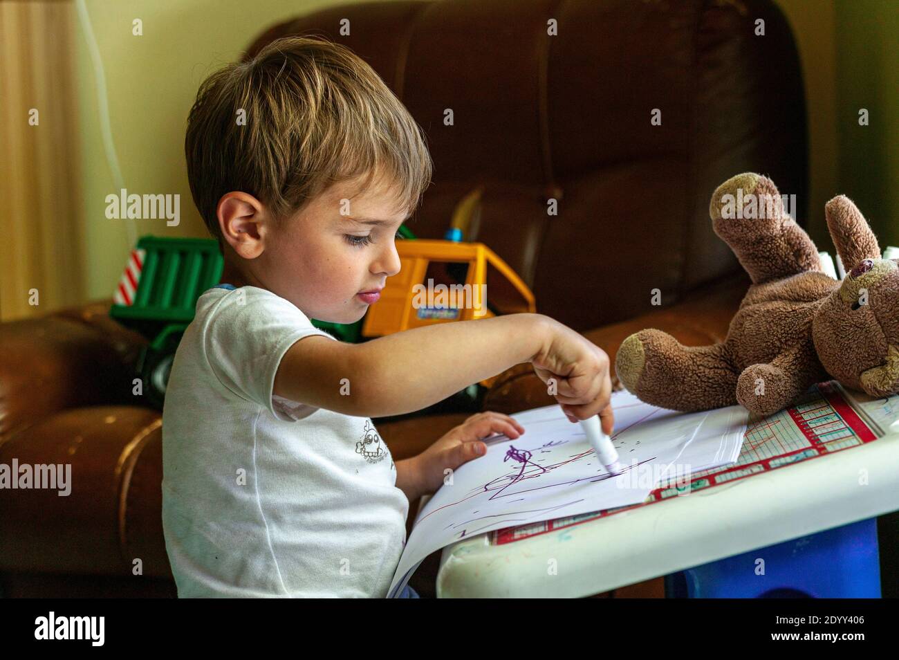 Child drawing with markers Stock Photo - Alamy