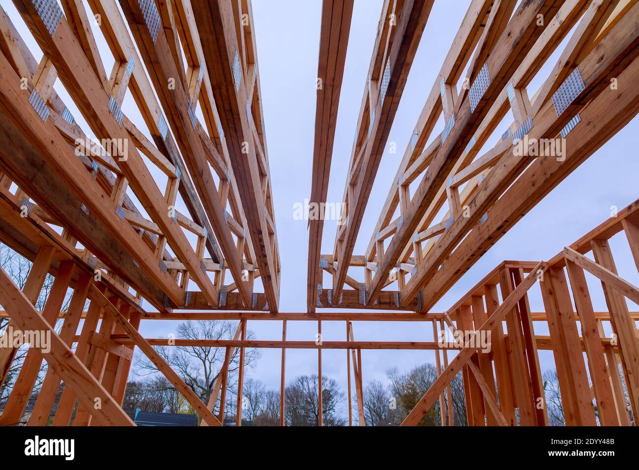 Framing of under construction wooden house building frame structure on ...