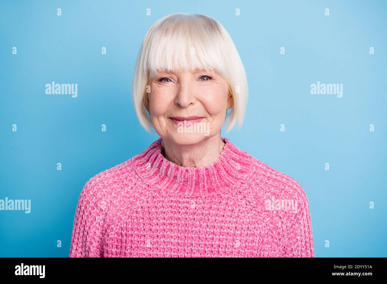 Photo portrait of positive old lady isolated on pastel blue colored ...