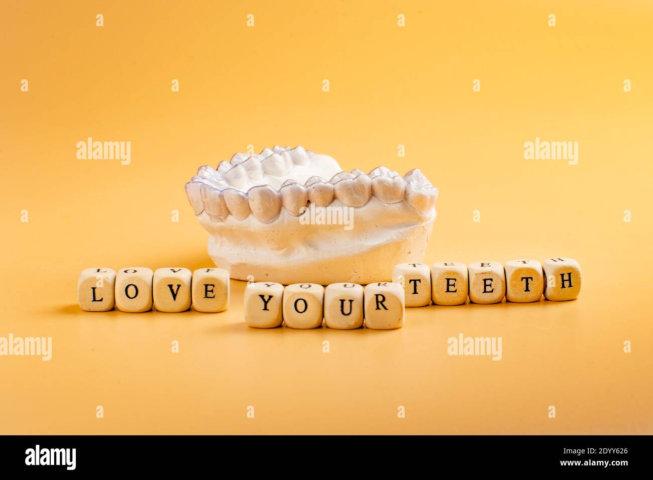 Close-up individual tooth tray Orthodontic dental theme. In hand ...