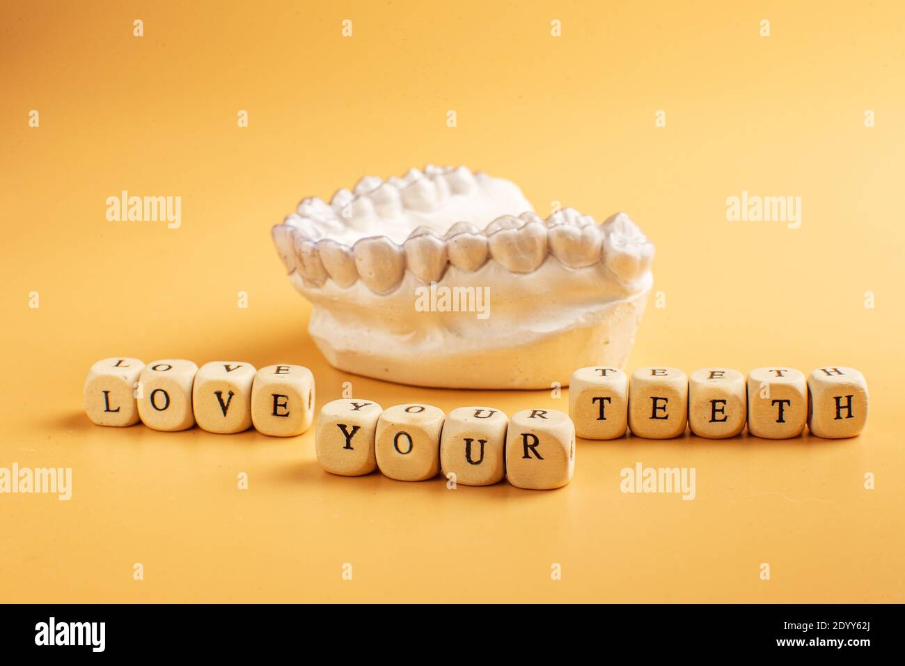 Close-up individual tooth tray Orthodontic dental theme. In hand ...