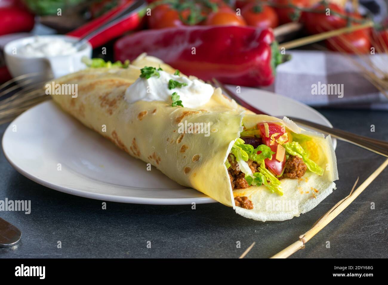 Delicious burrito with homemade wheat tortilla filled with spicy minced ...