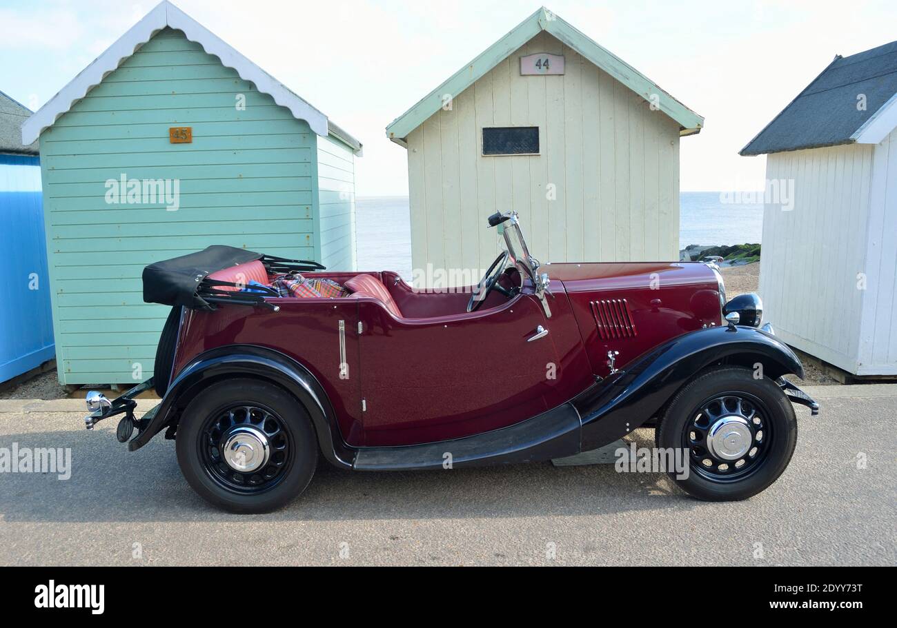 Classic Red Motor Car Parked on Seafront Promenade parked in front of ...
