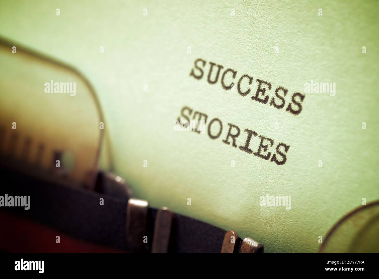 Success stories phrase written with a typewriter Stock Photo - Alamy