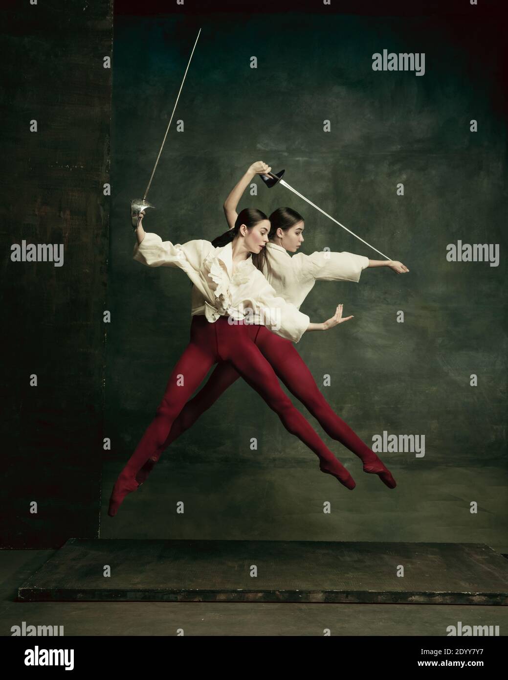 Fatal. Two young female ballet dancers like duelists with swords on ...