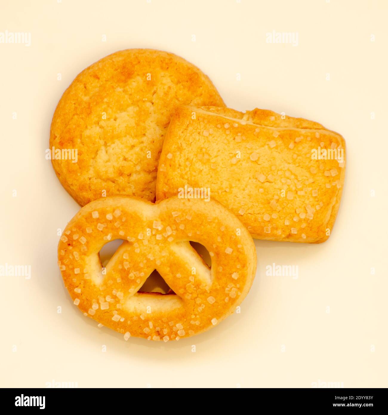 Sugar coated shortbread cookies biscuits golden brown on a white plate ...