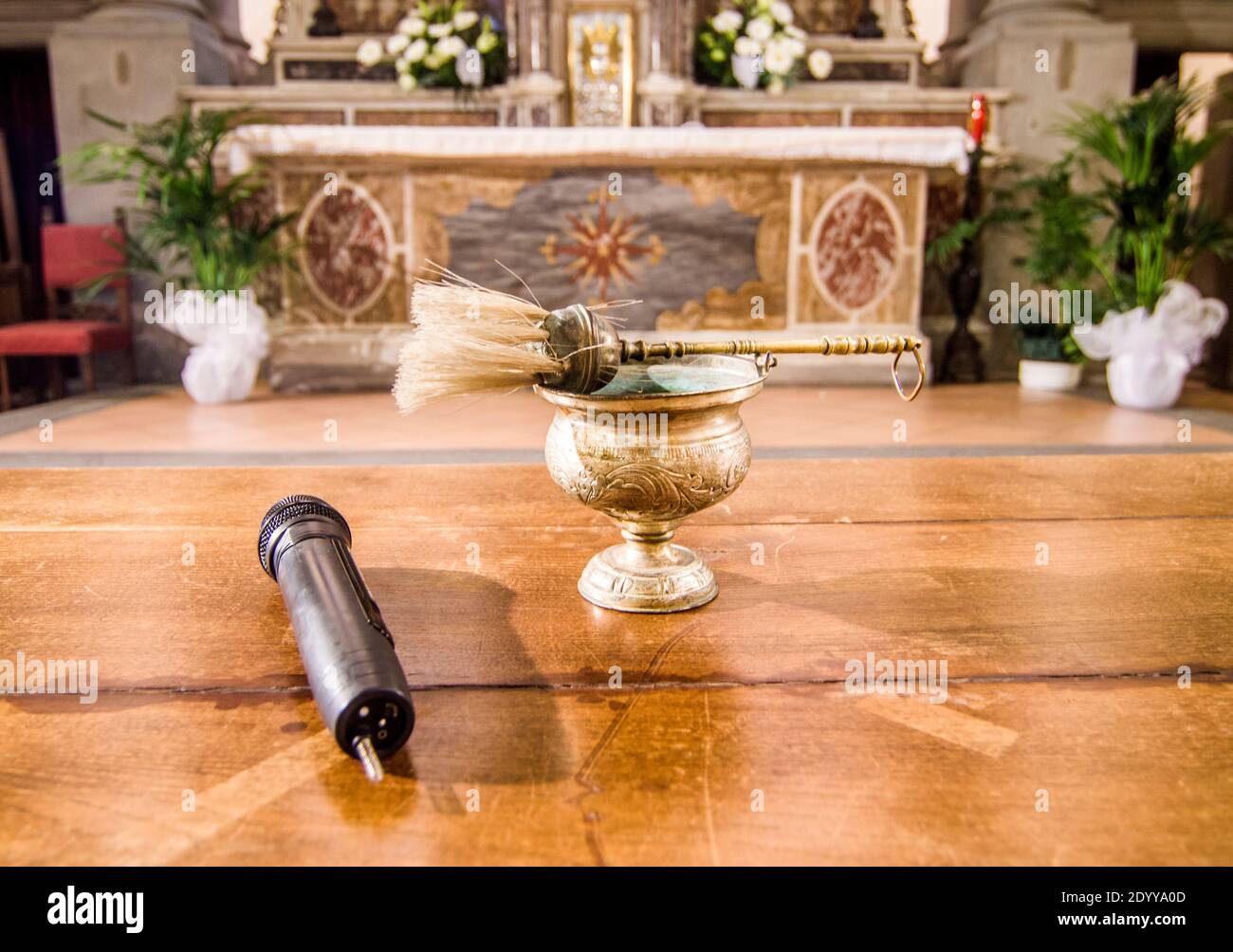 inside the church blessed water and microphone ready for the pope to ...