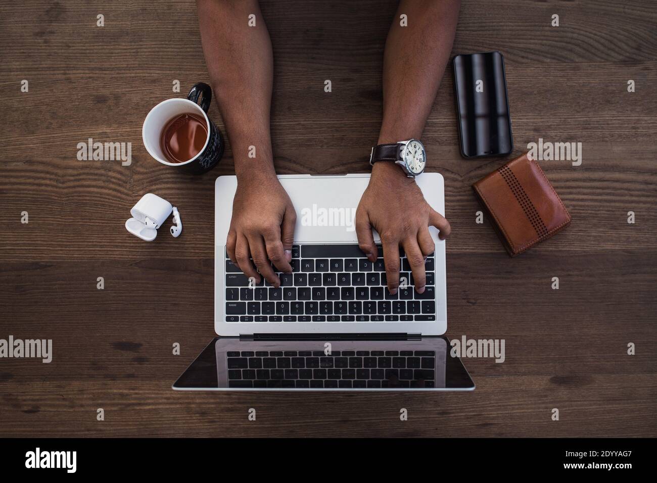 busy hands typing in flatlay Stock Photo - Alamy