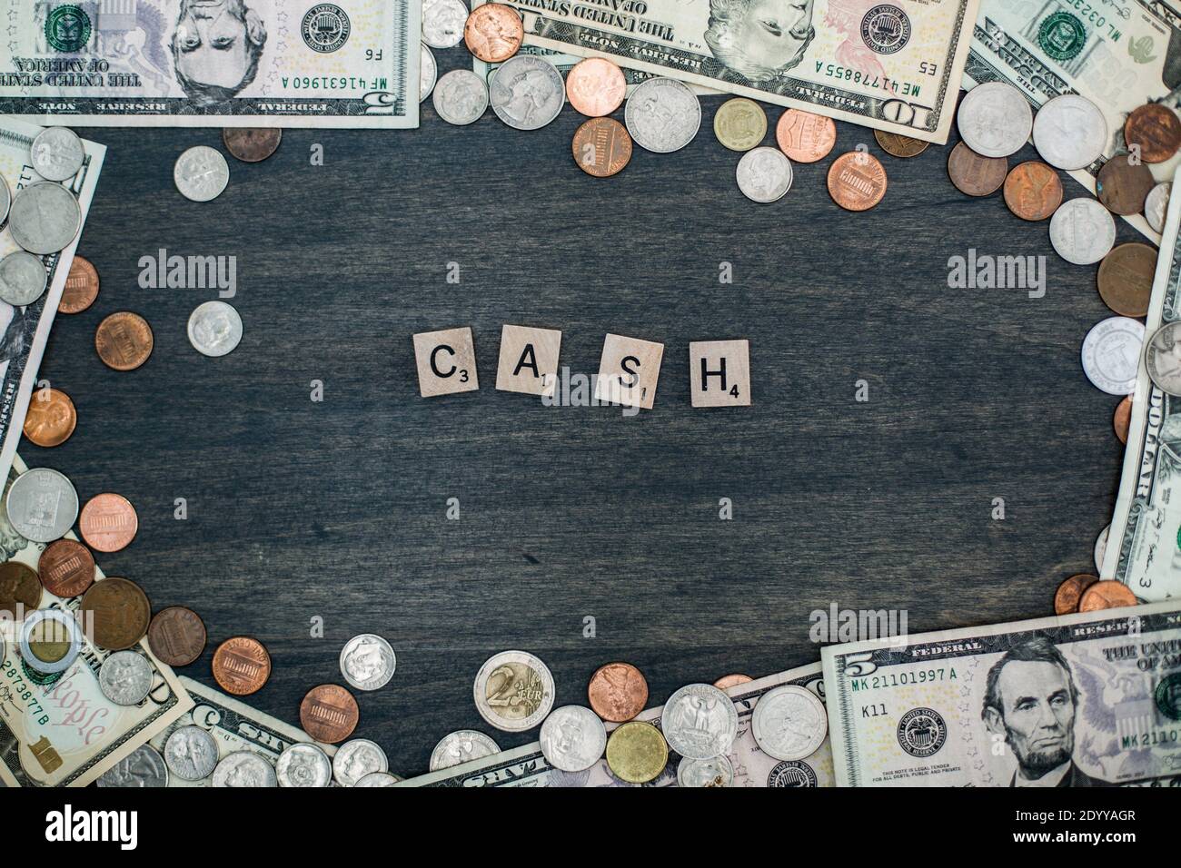 cash letter tiles with money Stock Photo - Alamy