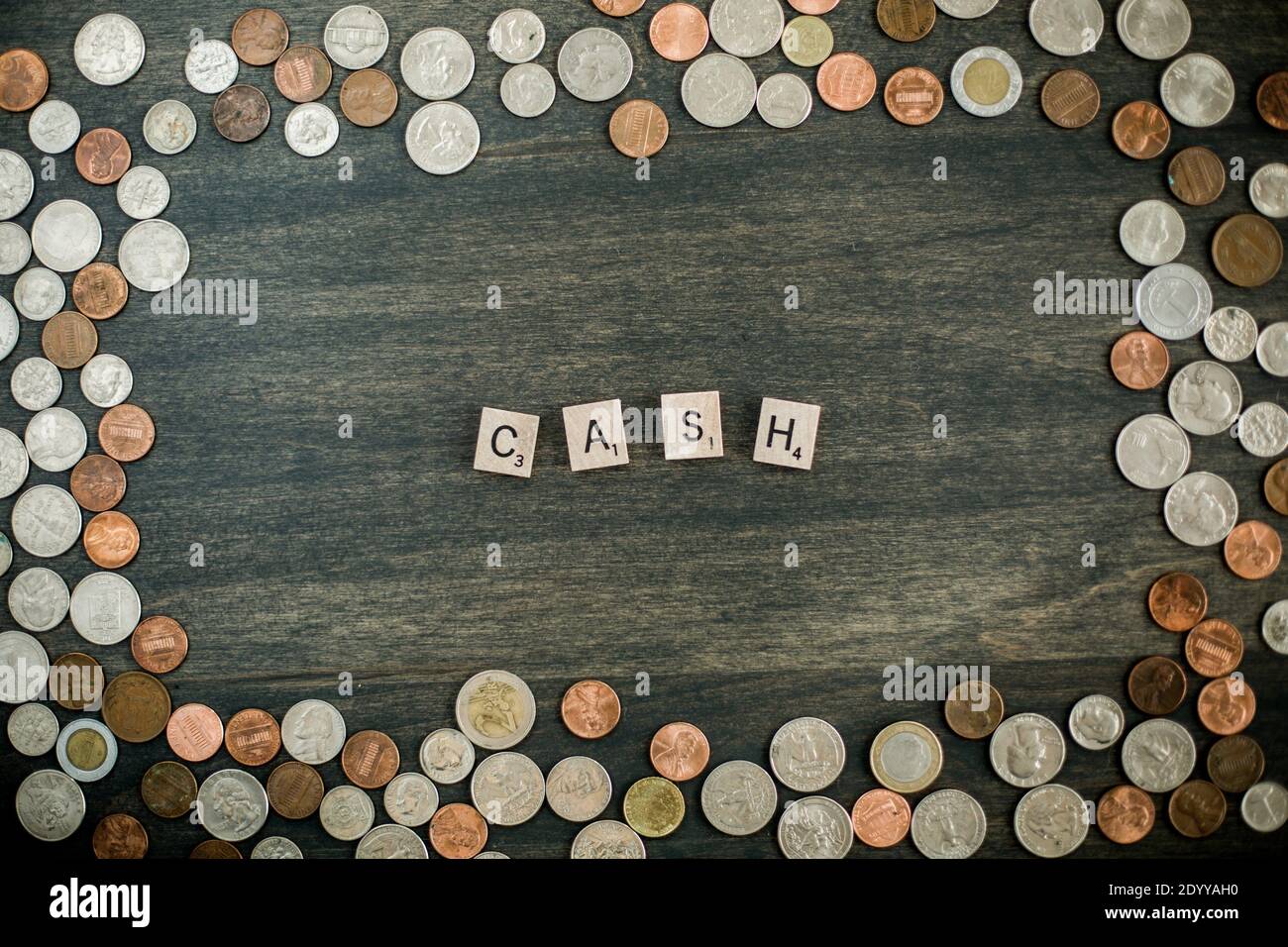 cash letters surrounded by coins Stock Photo - Alamy