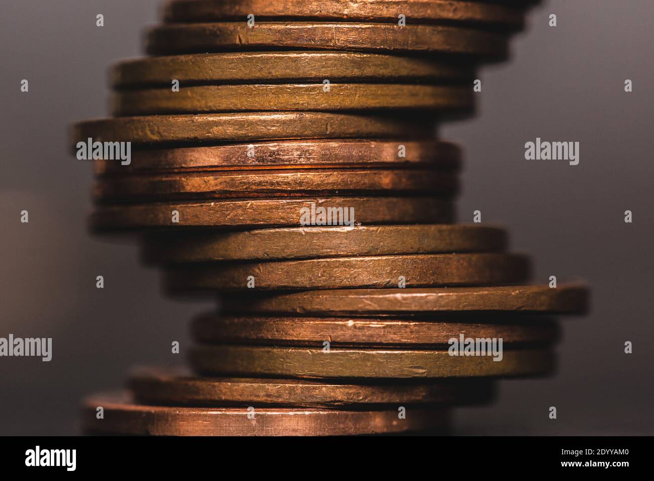 coins stacked in crooked pile Stock Photo - Alamy