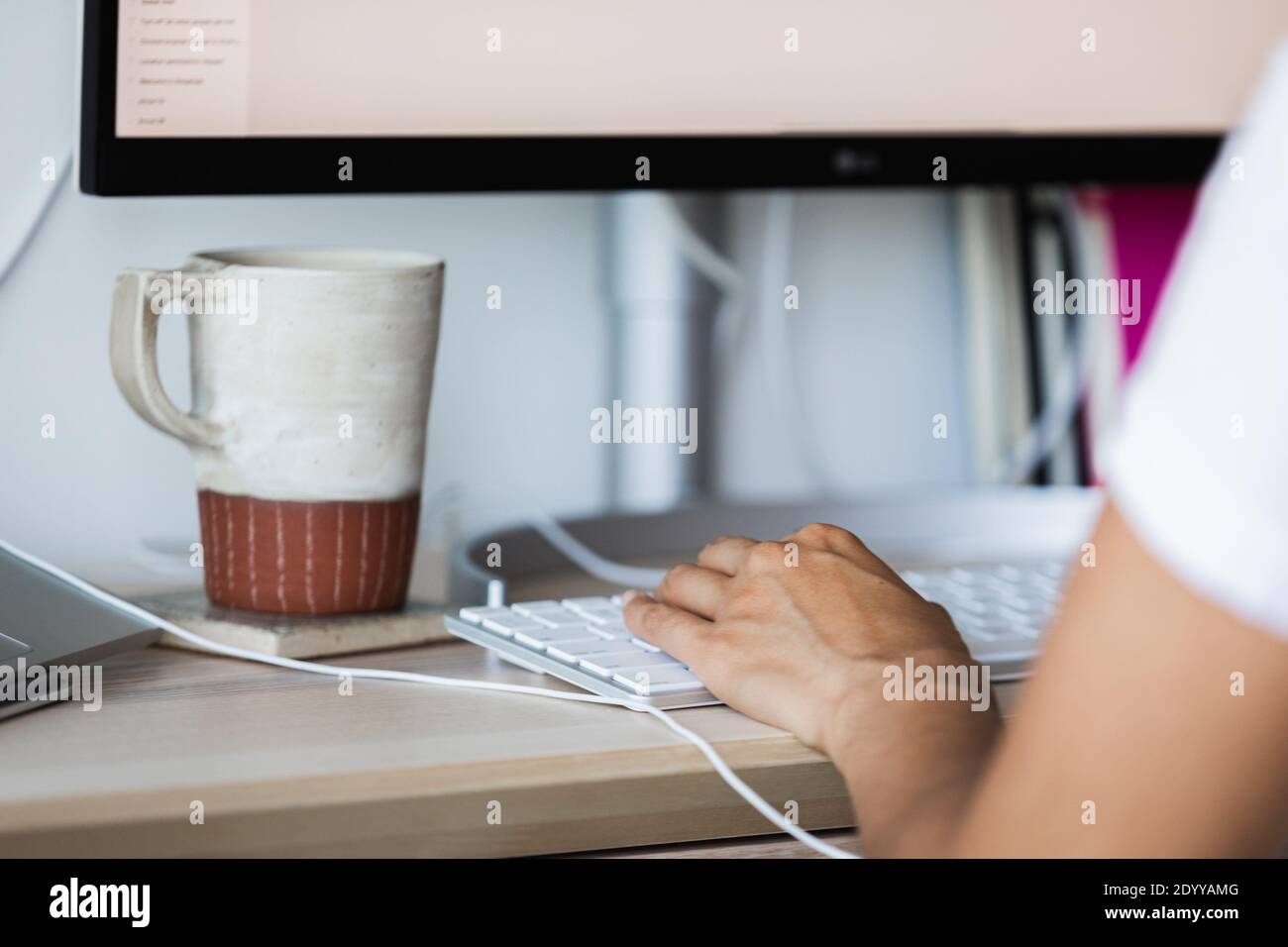hands typing away on the keyboard Stock Photo - Alamy