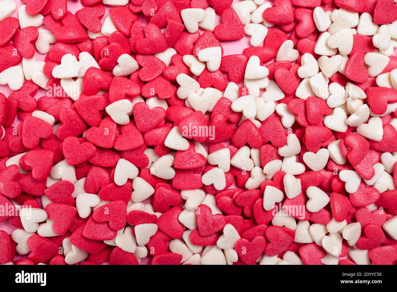 Valentine's day background with small hearts Stock Photo - Alamy