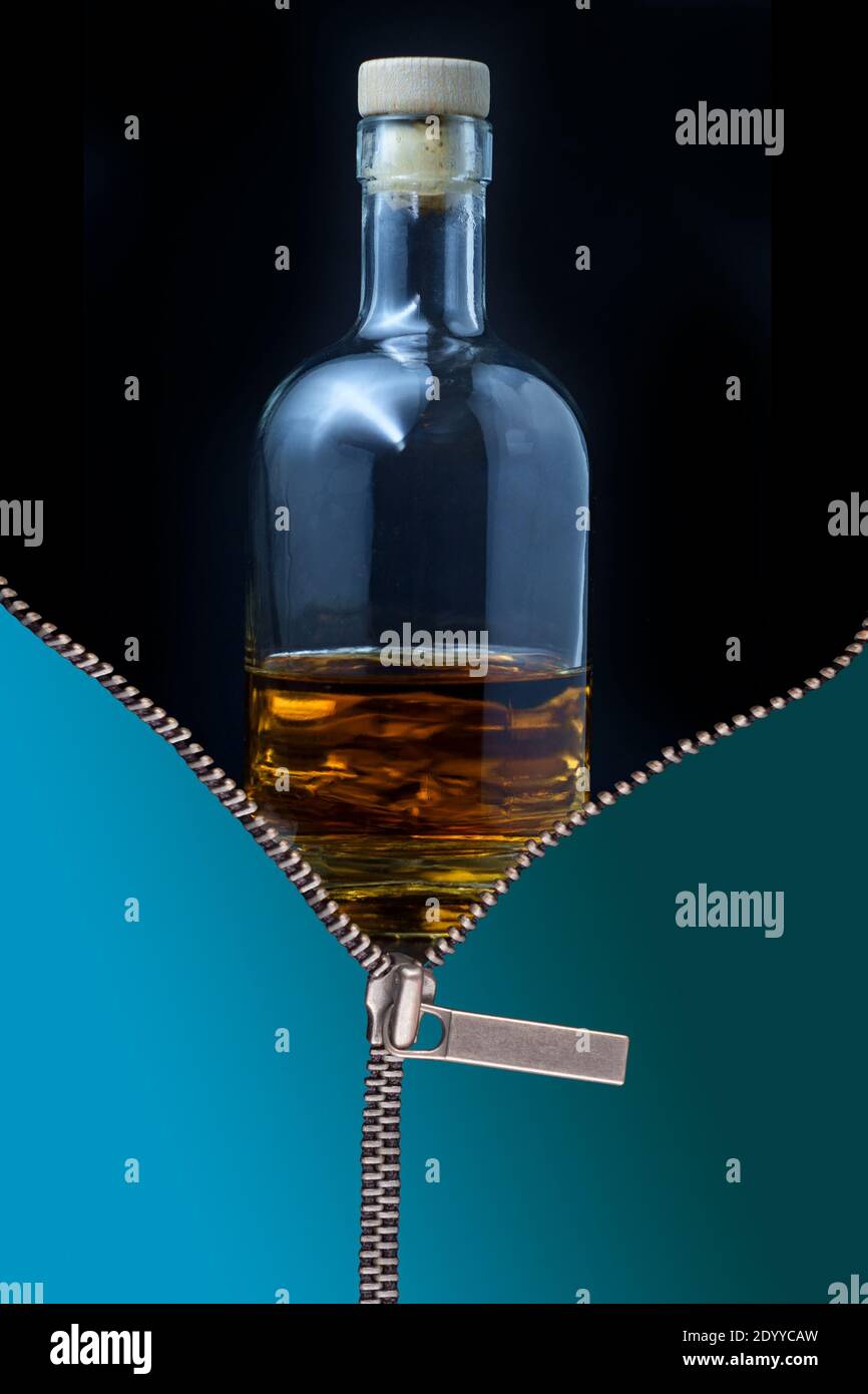 Open zipper reveals hidden bottle of whisky symbolizing secret ...