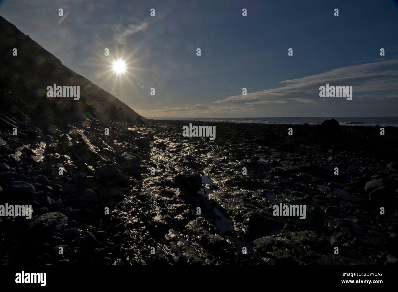 Beach by cliff coastal path with pebbles,rocks and unique stacked ...