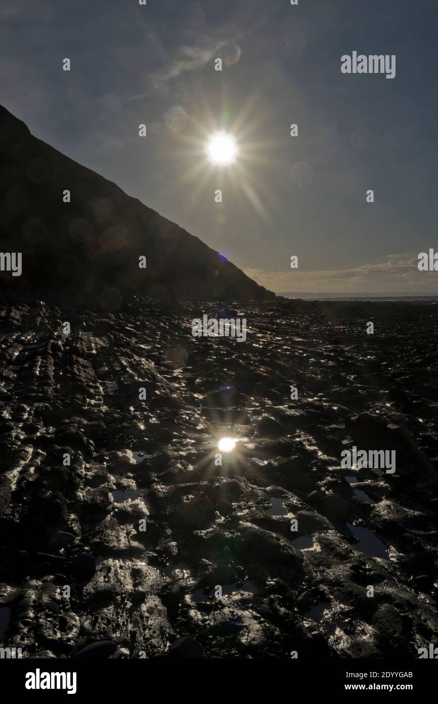 Beach by cliff coastal path with pebbles,rocks and unique stacked ...