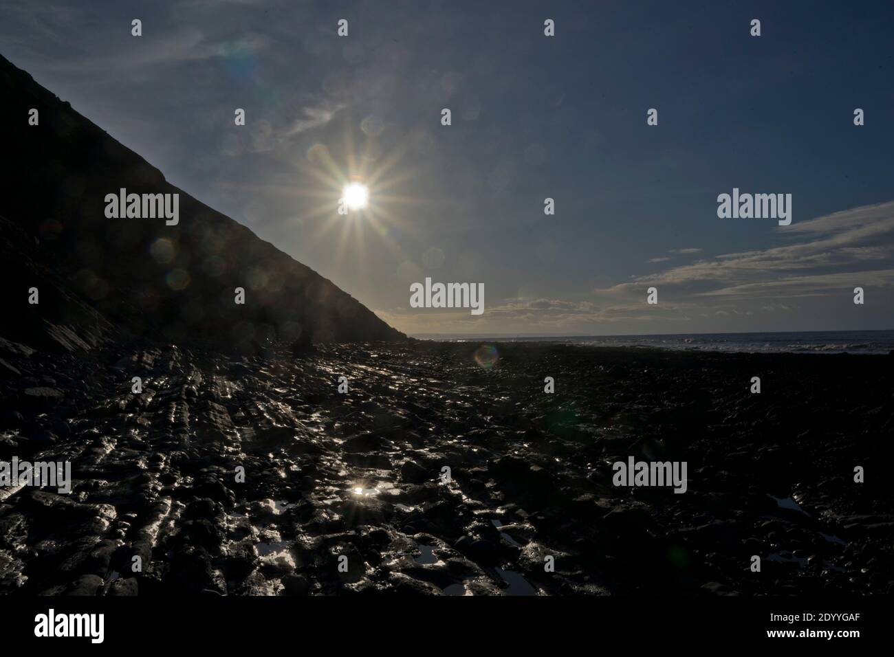 Beach by cliff coastal path with pebbles,rocks and unique stacked ...